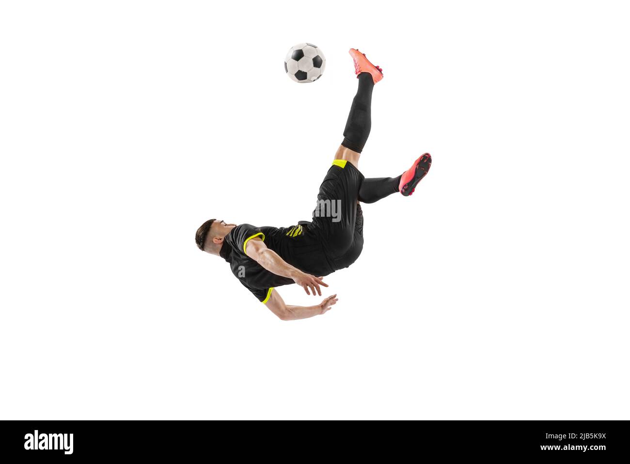 Dynamic portrait of professional male football soccer player training ...