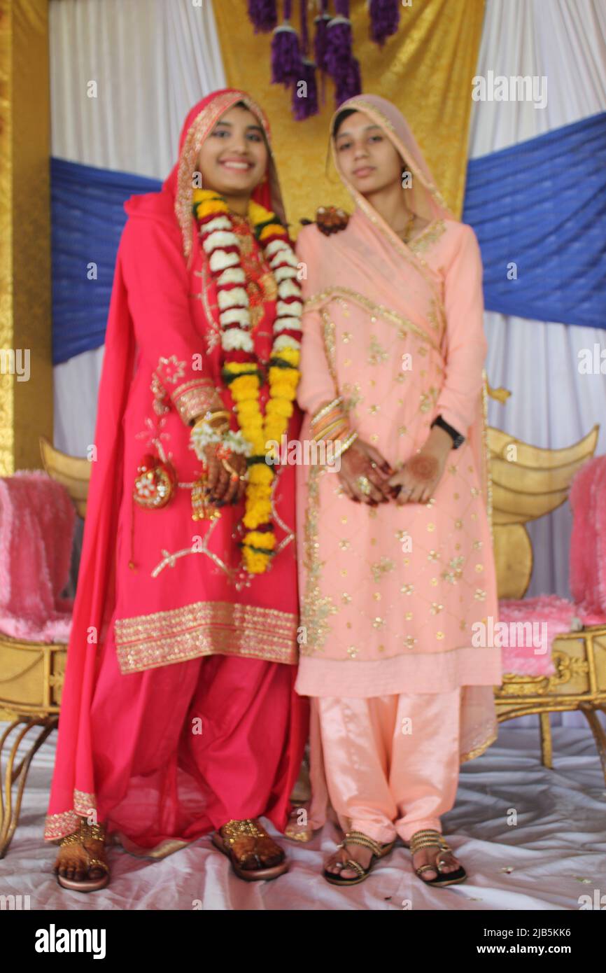 Portrait of adorable smiling Pakistani Muslim girl in traditional suit ...