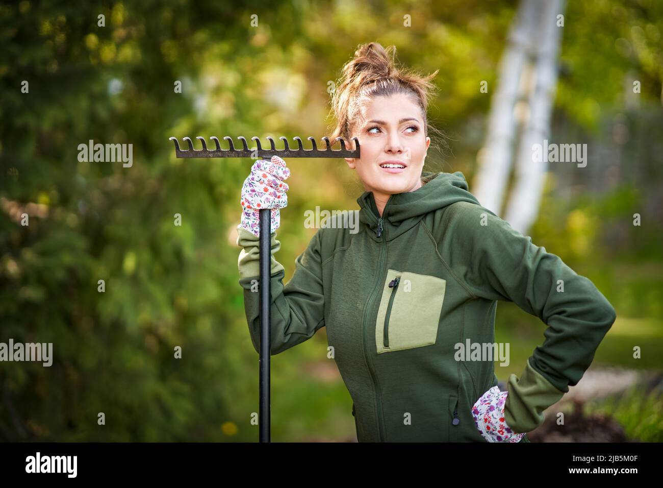 Picture of woman working with tools in the garden Stock Photo - Alamy