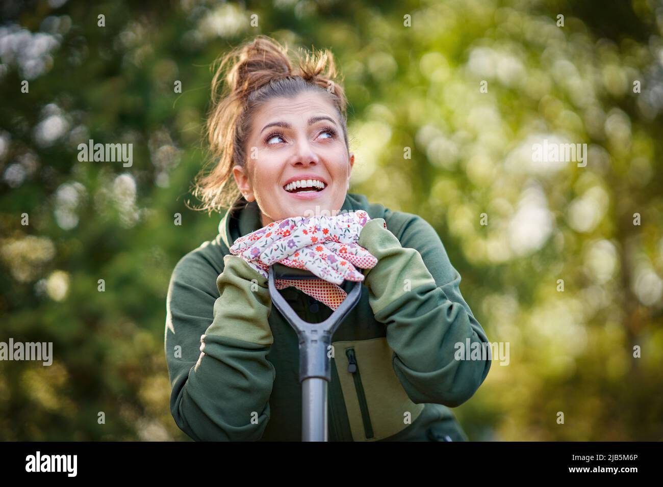 Picture of woman working with tools in the garden Stock Photo - Alamy