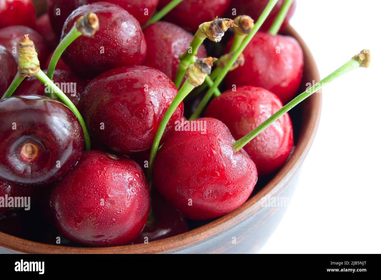 Sweet cherries in a ceramic bowl on white background, closeup. Fresh ...