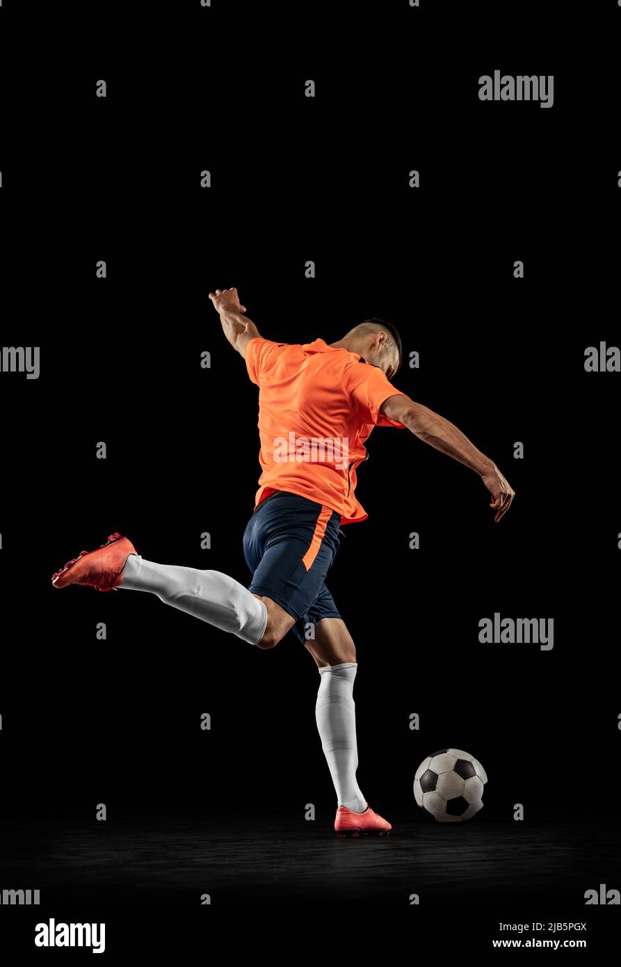 Dynamic portrait of professional male football soccer player in motion ...