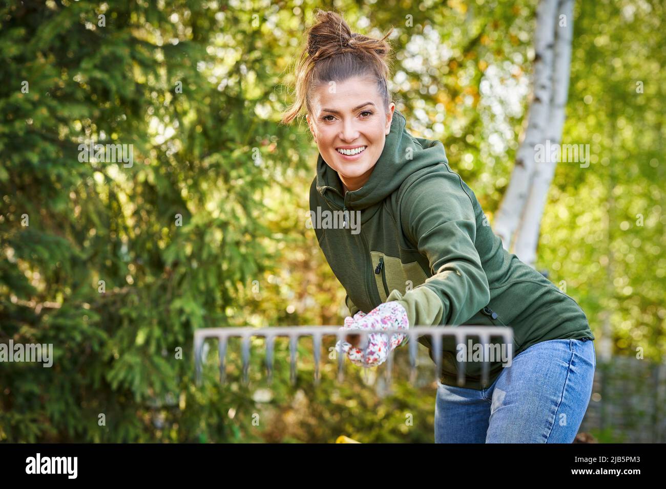 Picture of woman working with tools in the garden Stock Photo - Alamy