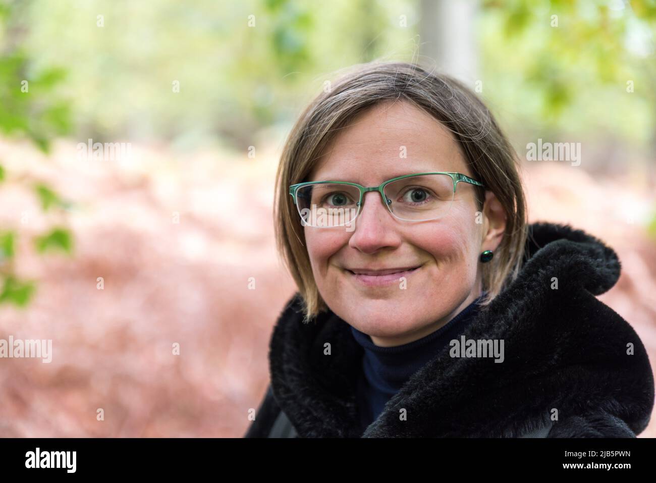Young woman posing in nature hi-res stock photography and images - Alamy