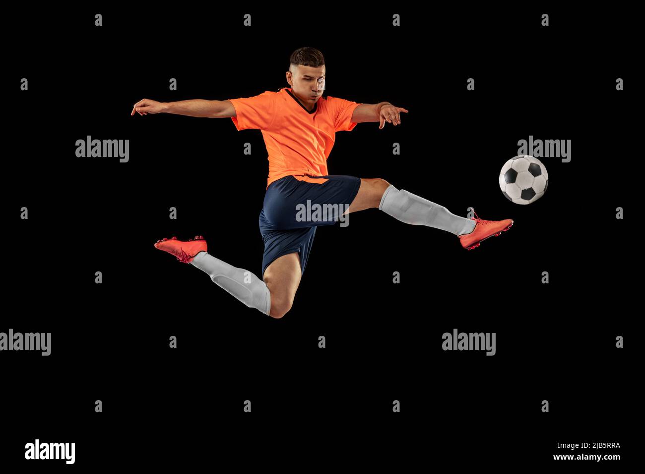 Dynamic portrait of professional male football soccer player in motion ...