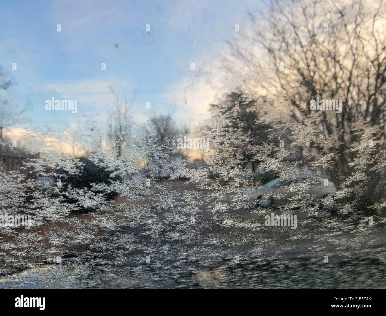 frozen water ice crystals on car window or windshield in winter Stock ...