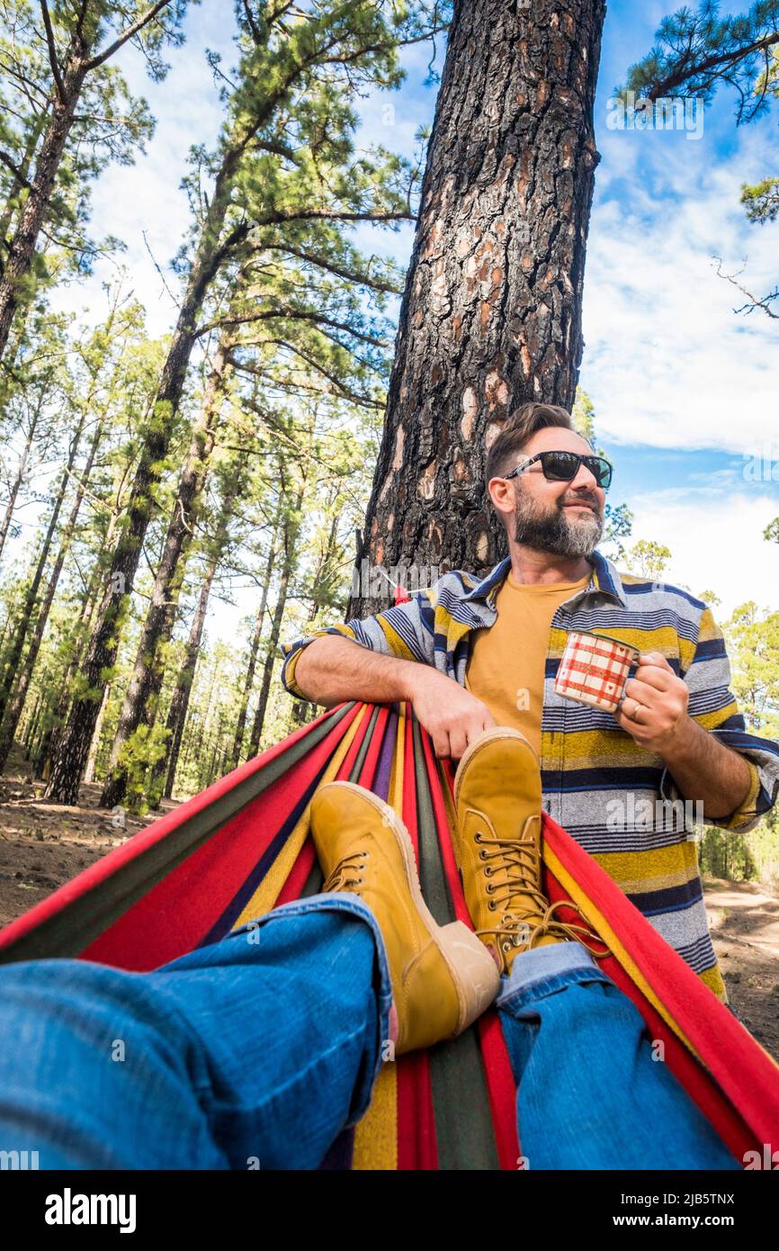 Cheerful man and woman having relax in the nature woods forest together ...