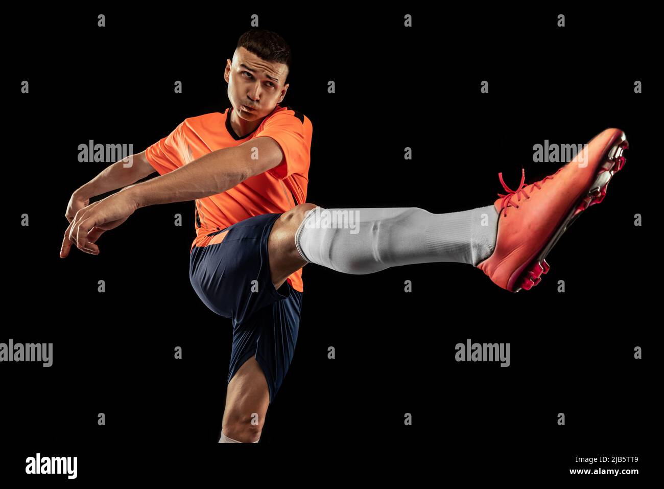 Dynamic portrait of professional male football soccer player in motion ...