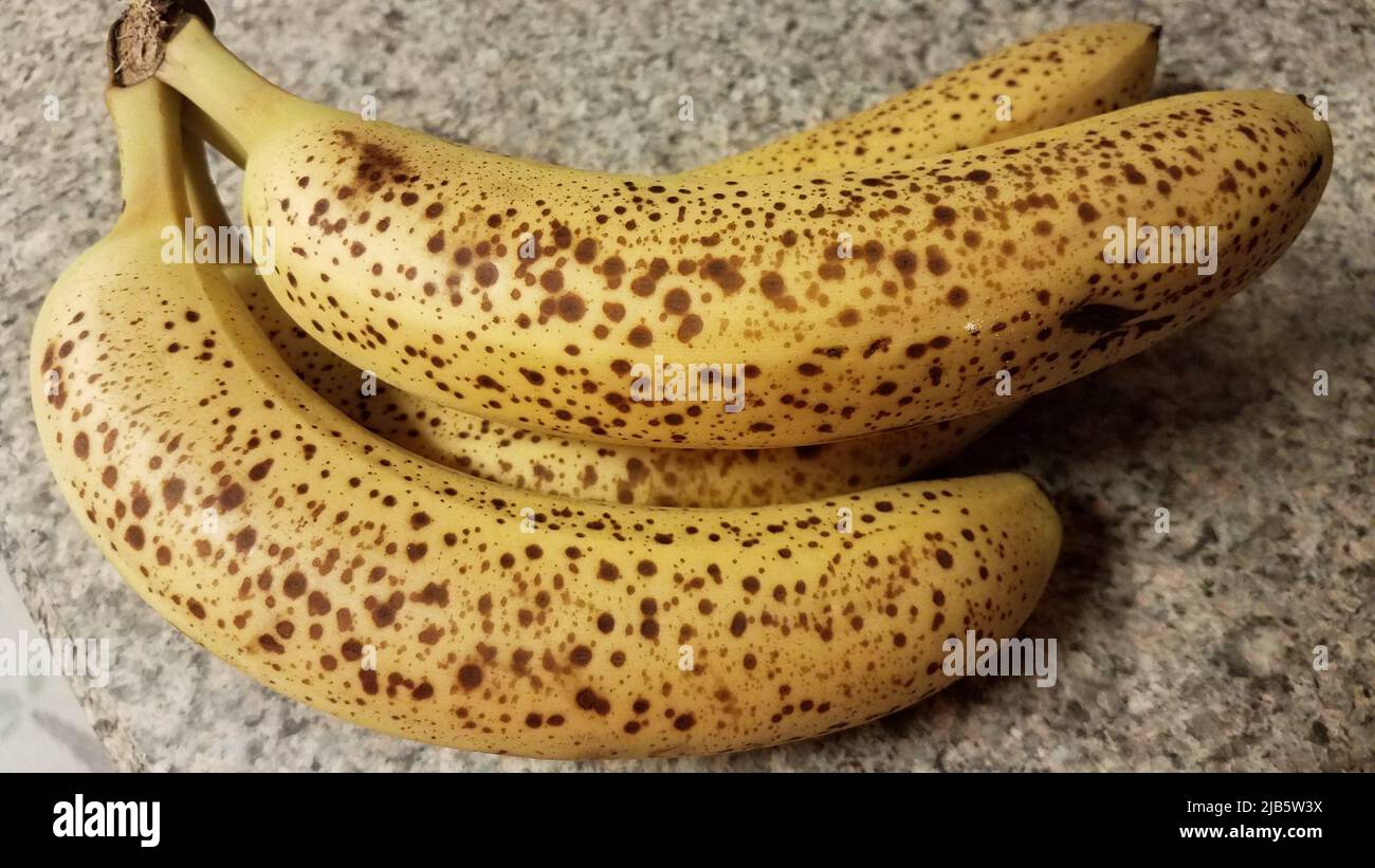 Banana with ripening spots hi-res stock photography and images - Alamy