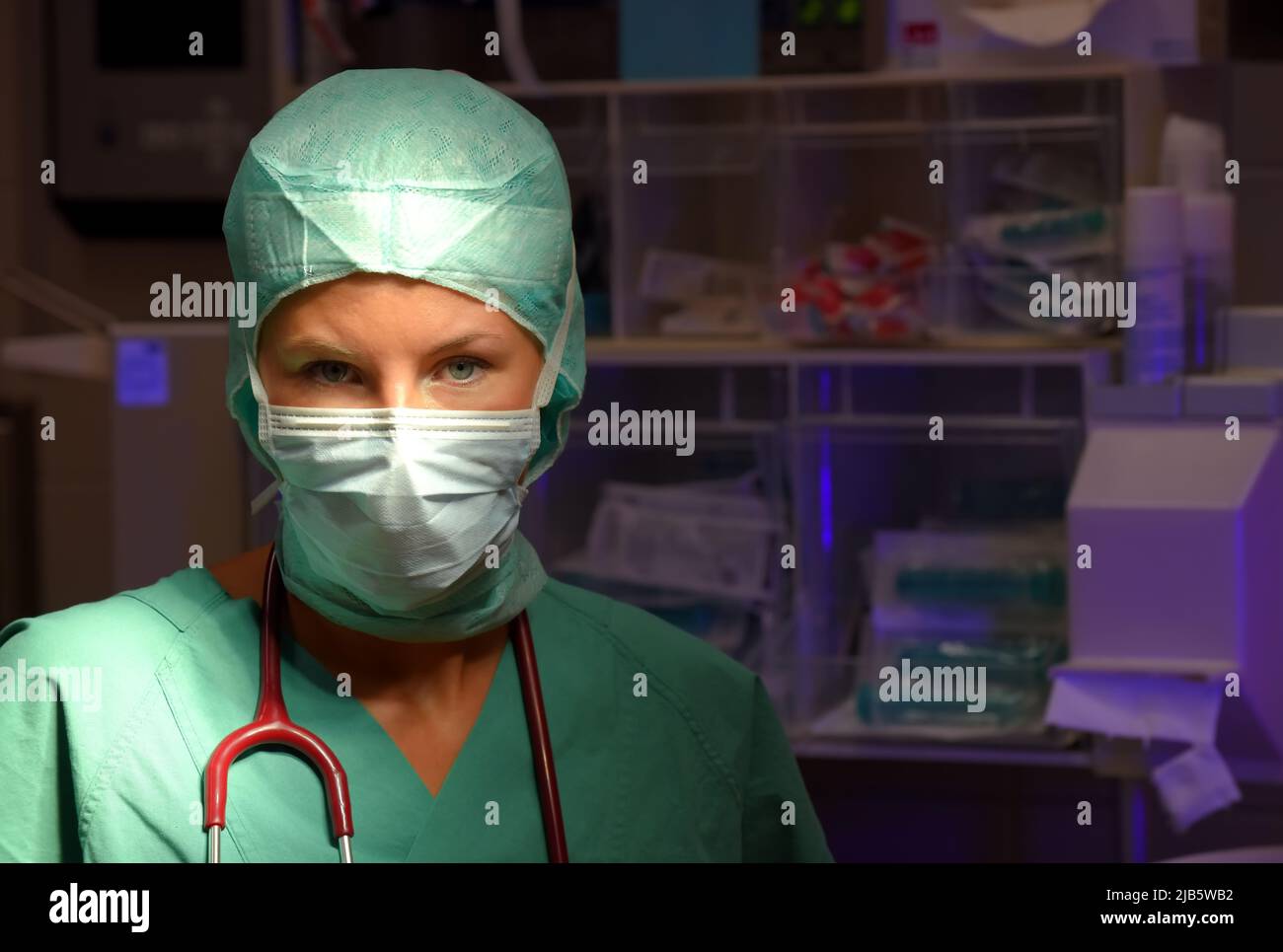 An anesthetic theater nurse is seen in an operation theater. She is ...