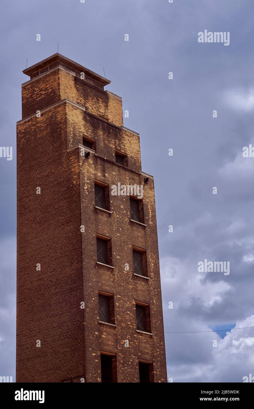 old red brick fire service drill tower or training tower against ...