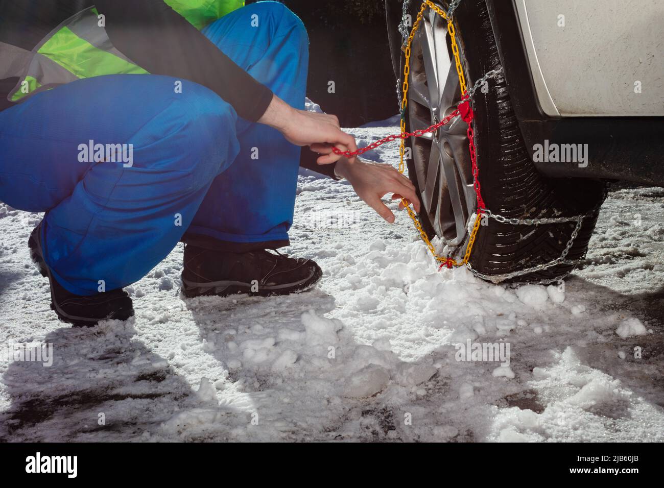 Putting on chains hi-res stock photography and images - Alamy