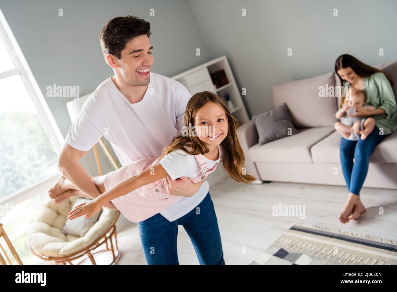 Portrait of full idyllic friendly family playing spend pastime living ...