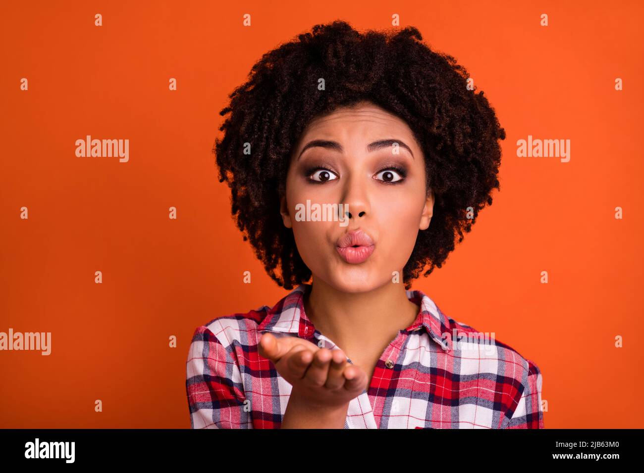 Photo Of Sweet Shiny Woman Wear Plaid Shirt Sending Kiss Arm You