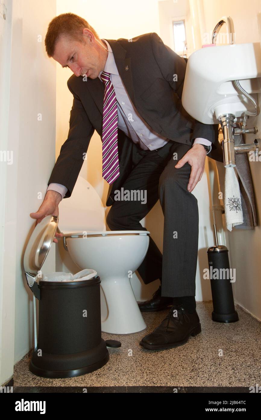 Netherlands. Security guard is checking the bathroom for possible ...