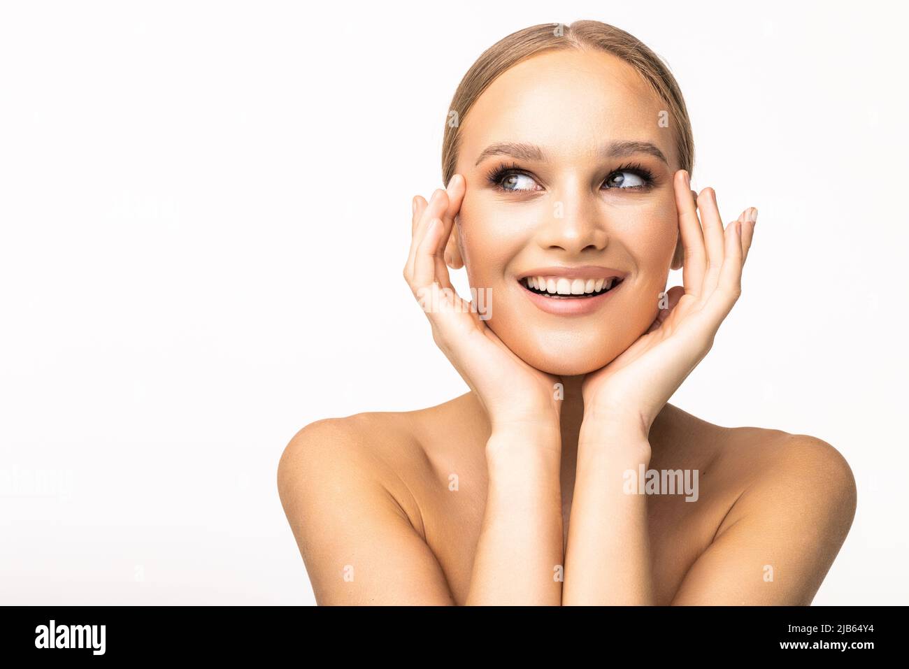 Beautiful young girl with a light natural make-up and perfect skin ...