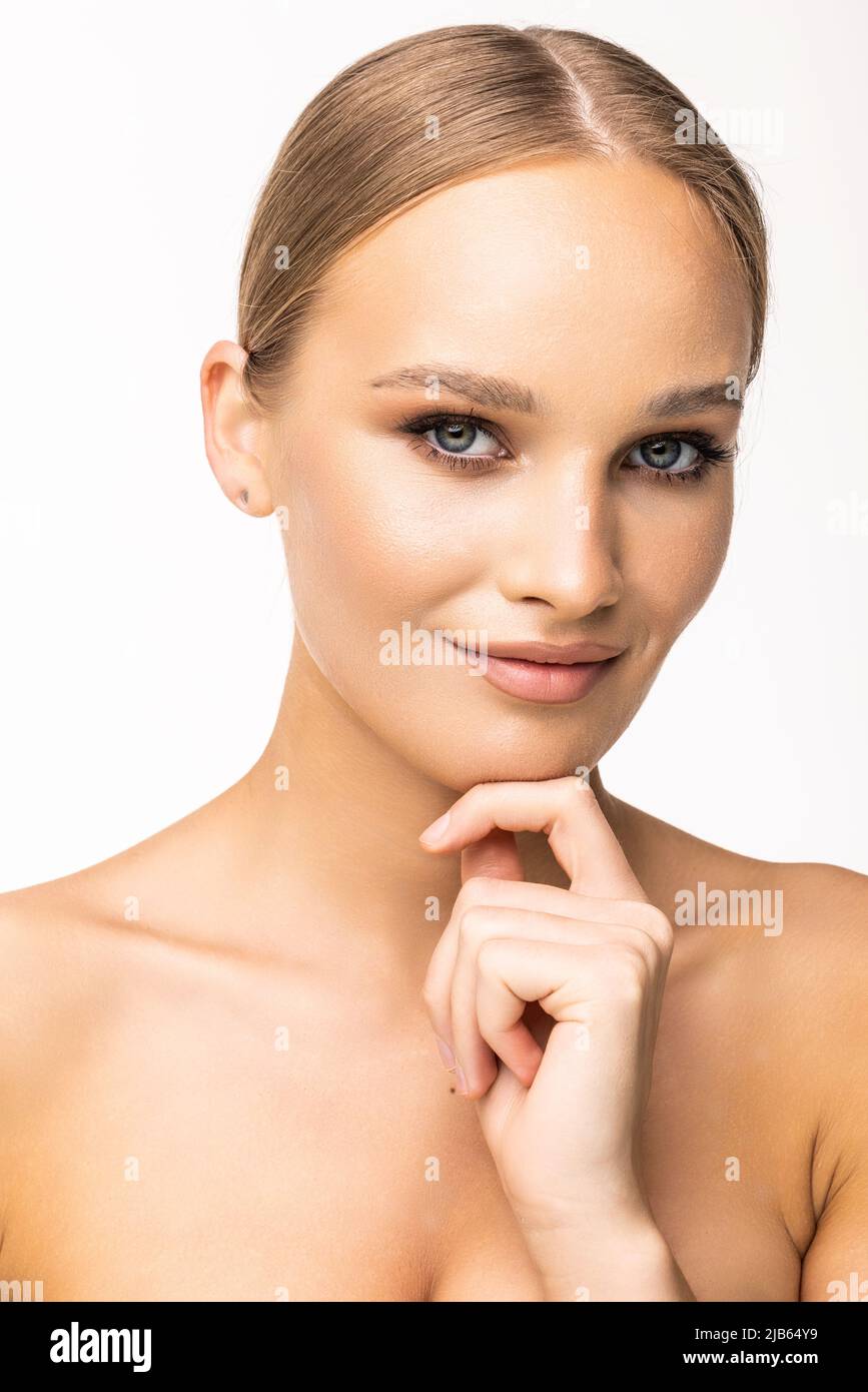 Beautiful young girl with a light natural make-up and perfect skin ...