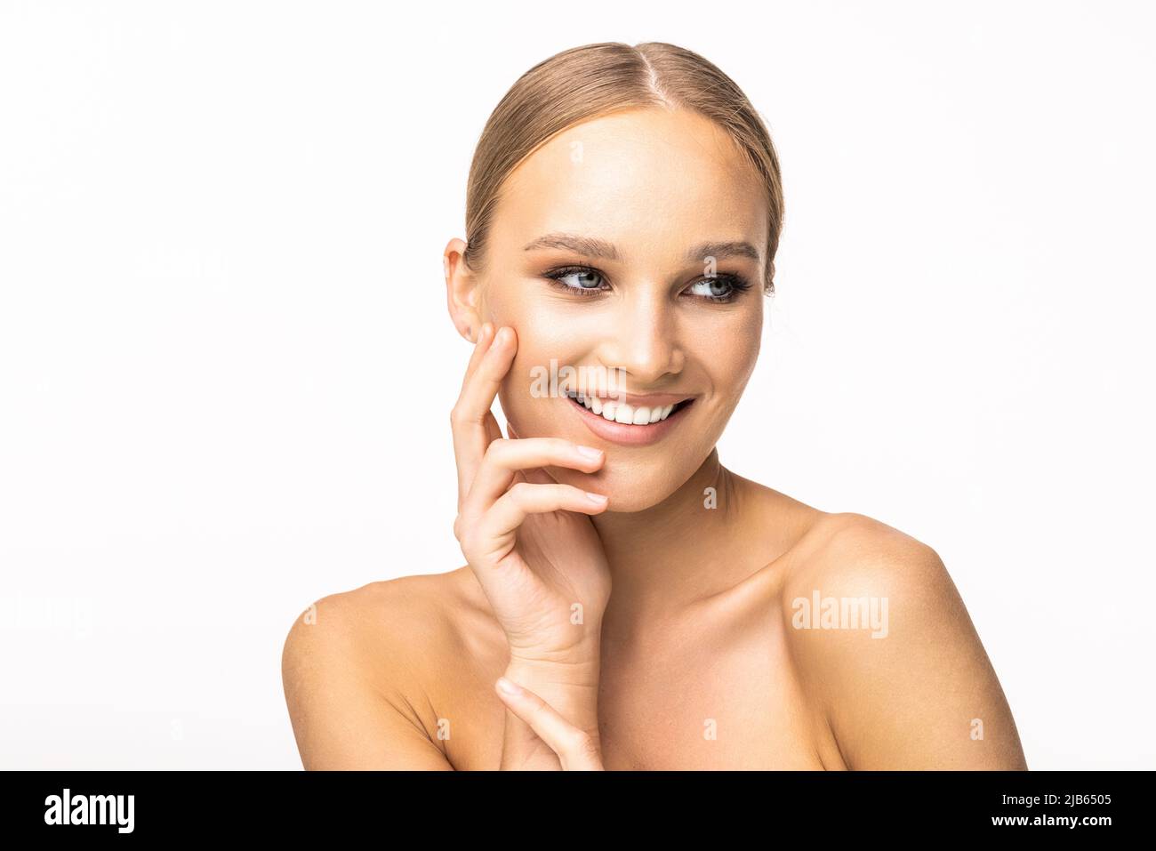 Beautiful young girl with a light natural make-up and perfect skin ...