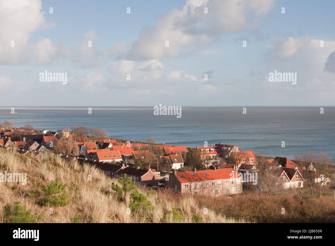 Netherlands, Vlieland - houses near the sea in Oost-Vlieland village ...