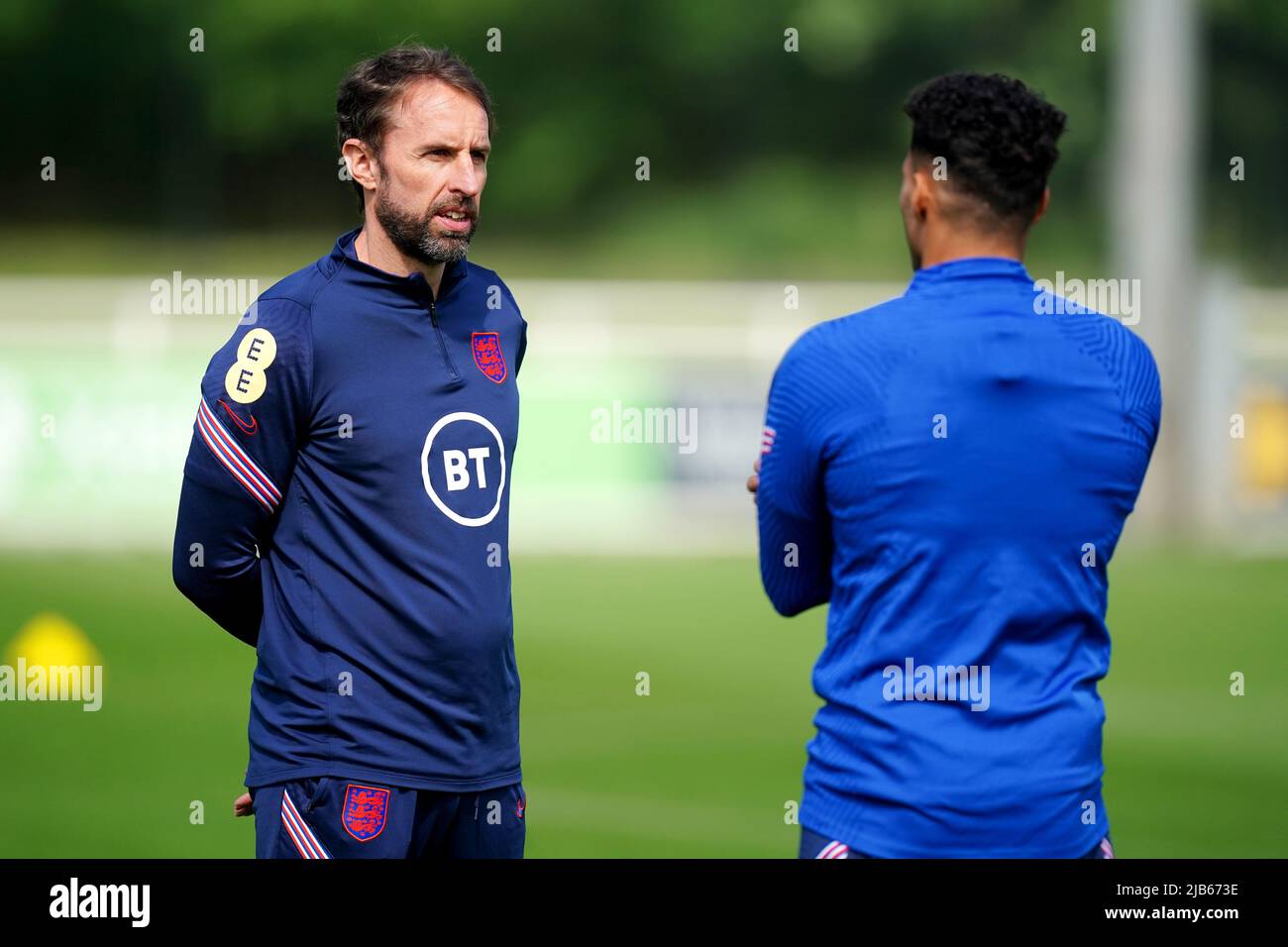 England manager Gareth Southgate speaks to James Justin during a ...