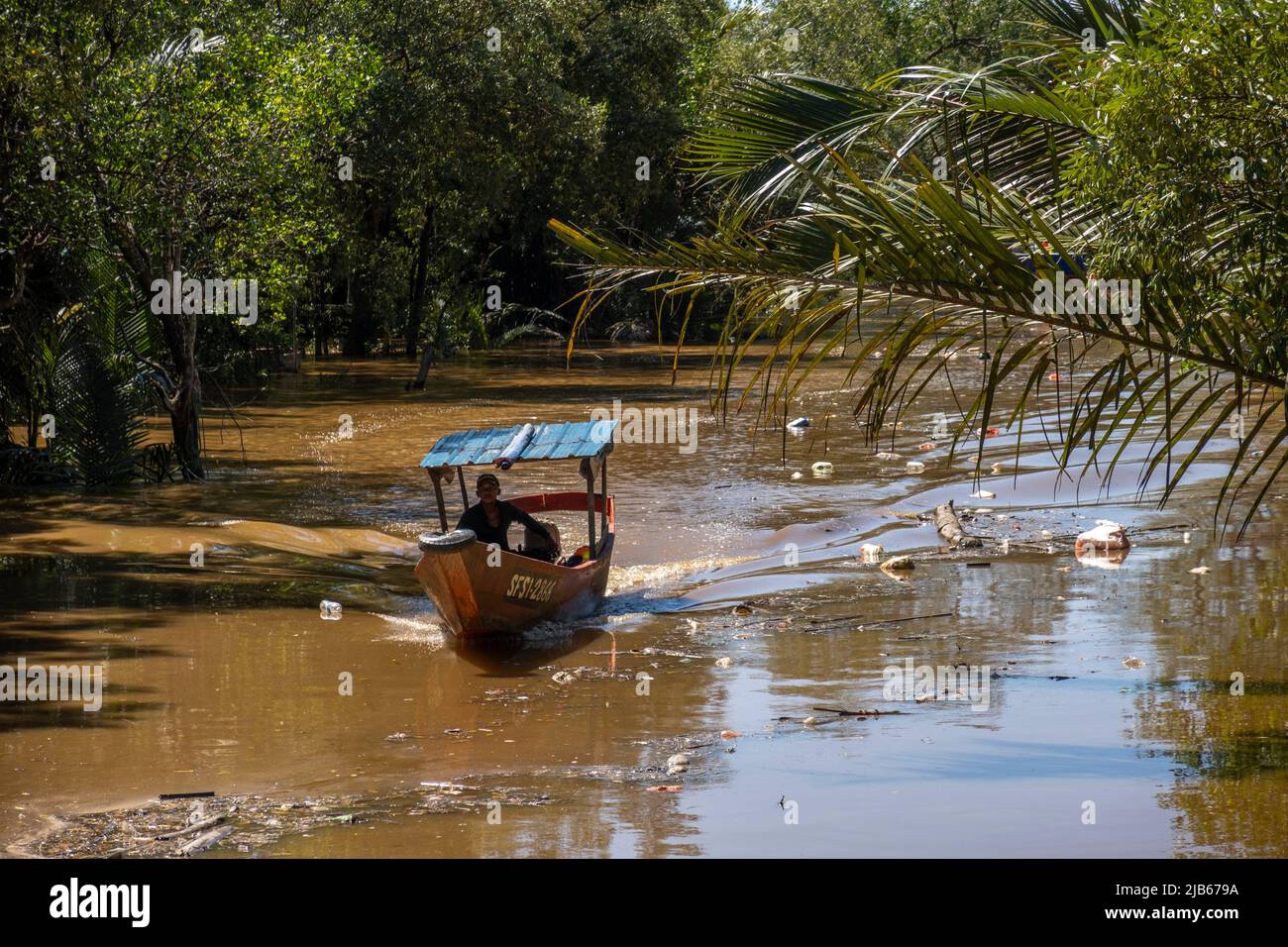Small boat sailing at Maludam river, Sarawak, East Malaysia, Borneo ...