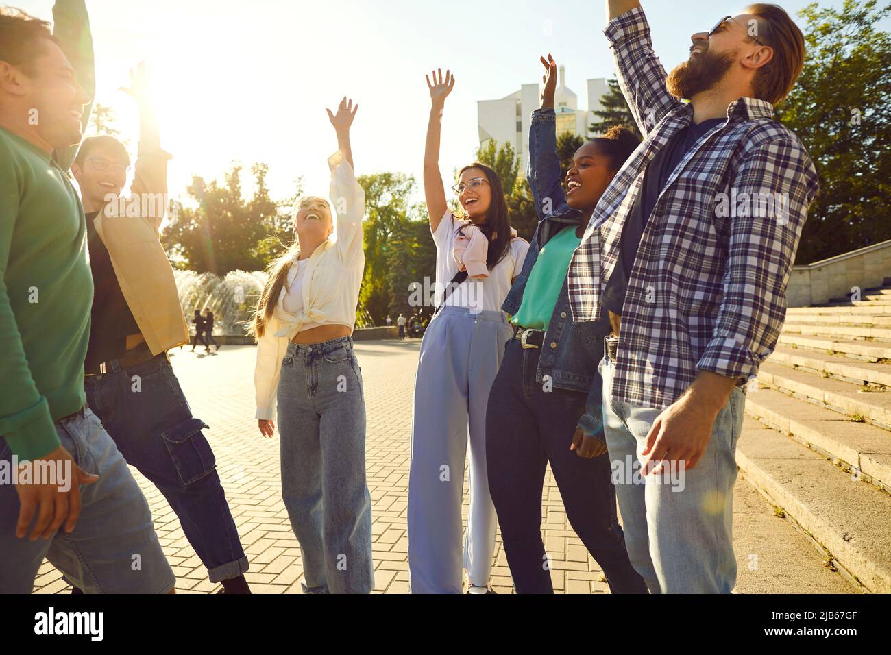 Diverse group of happy excited friends having fun during their meet up ...