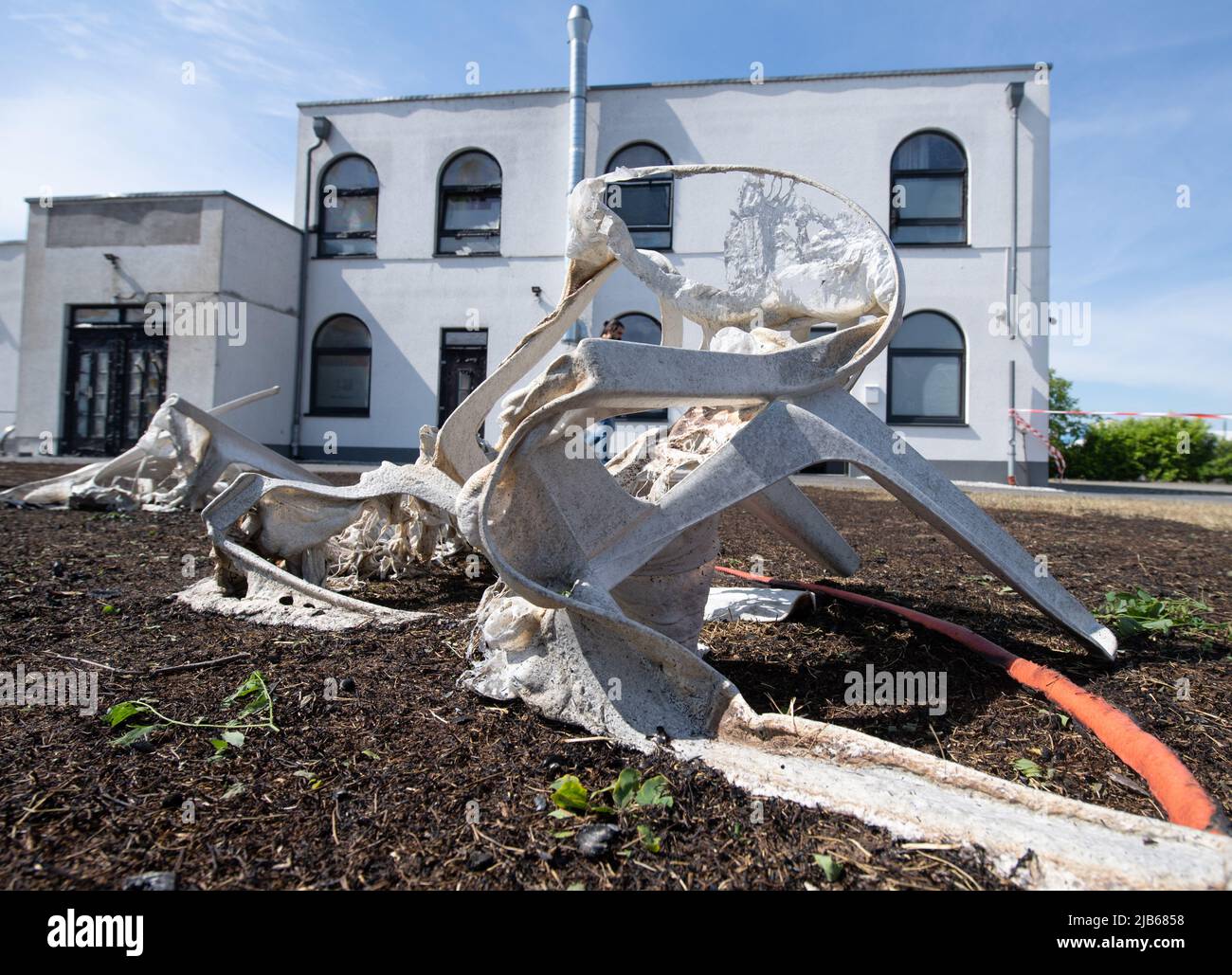 Ginsheim Gustavsburg, Germany. 03rd June, 2022. A melted plastic chair ...