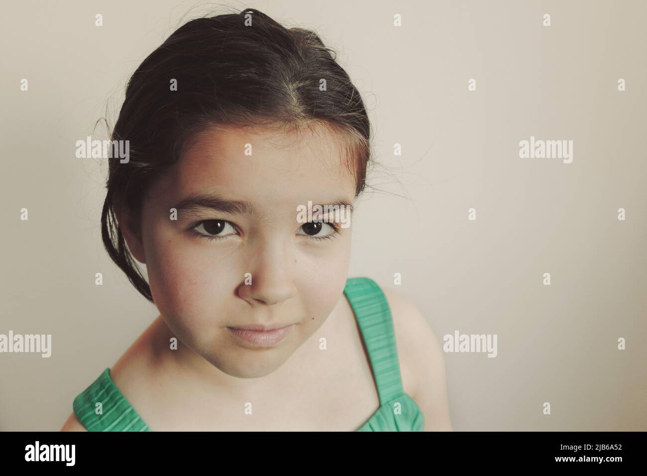 Small girl posing, facial expression Stock Photo - Alamy