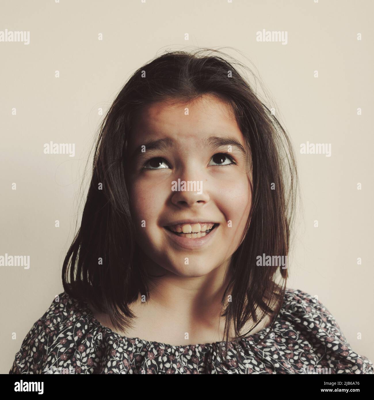 Small girl posing, facial expression Stock Photo - Alamy