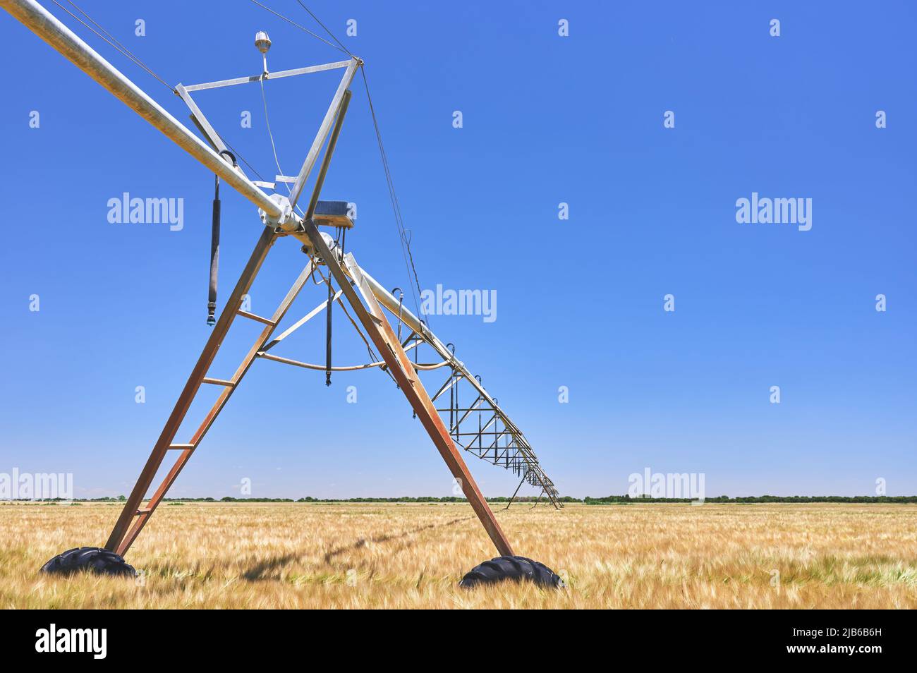 detail of a circular pivot irrigation system in a cereal field before ...