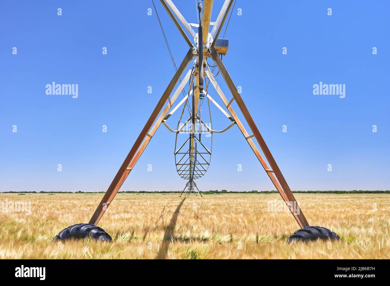 detail of a circular pivot irrigation system in a cereal field before ...