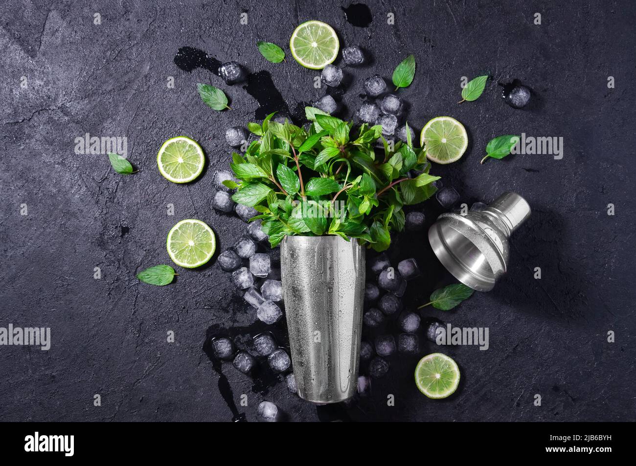 Chrome Bar Shaker With Lime, Mint and Ice on Dark Stone Table. Concept ...