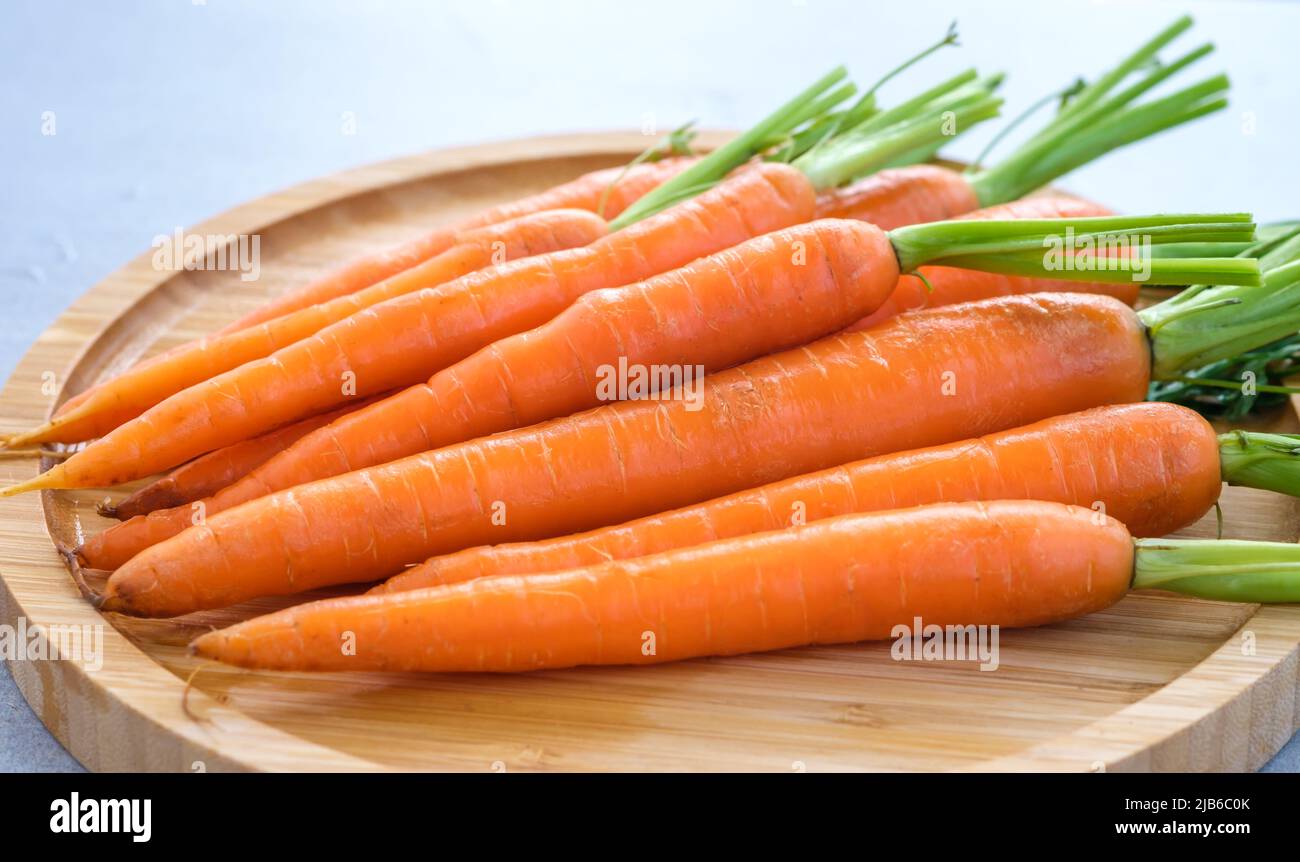 Raw carrots on tray hi-res stock photography and images - Alamy