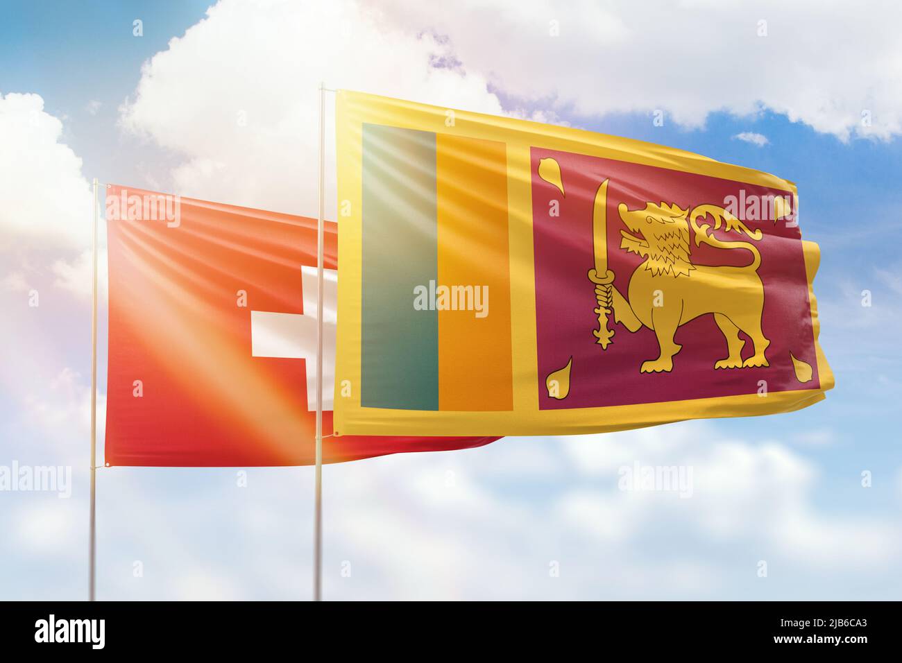 Sunny blue sky and flags of sri lanka and switzerland Stock Photo - Alamy