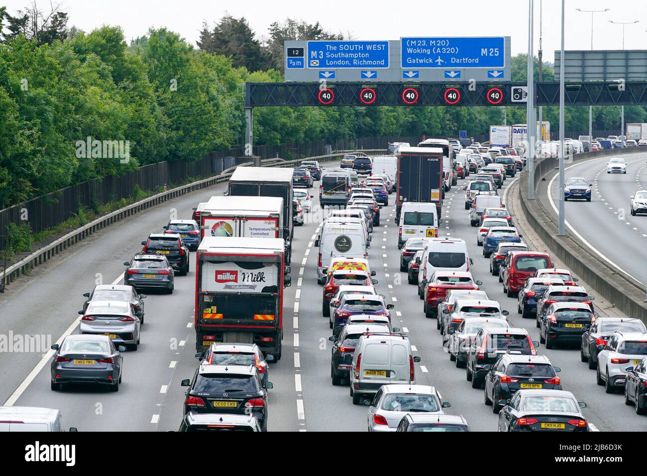 Vehicles queue on the M25 motorway near Egham, Surrey, on day two of ...
