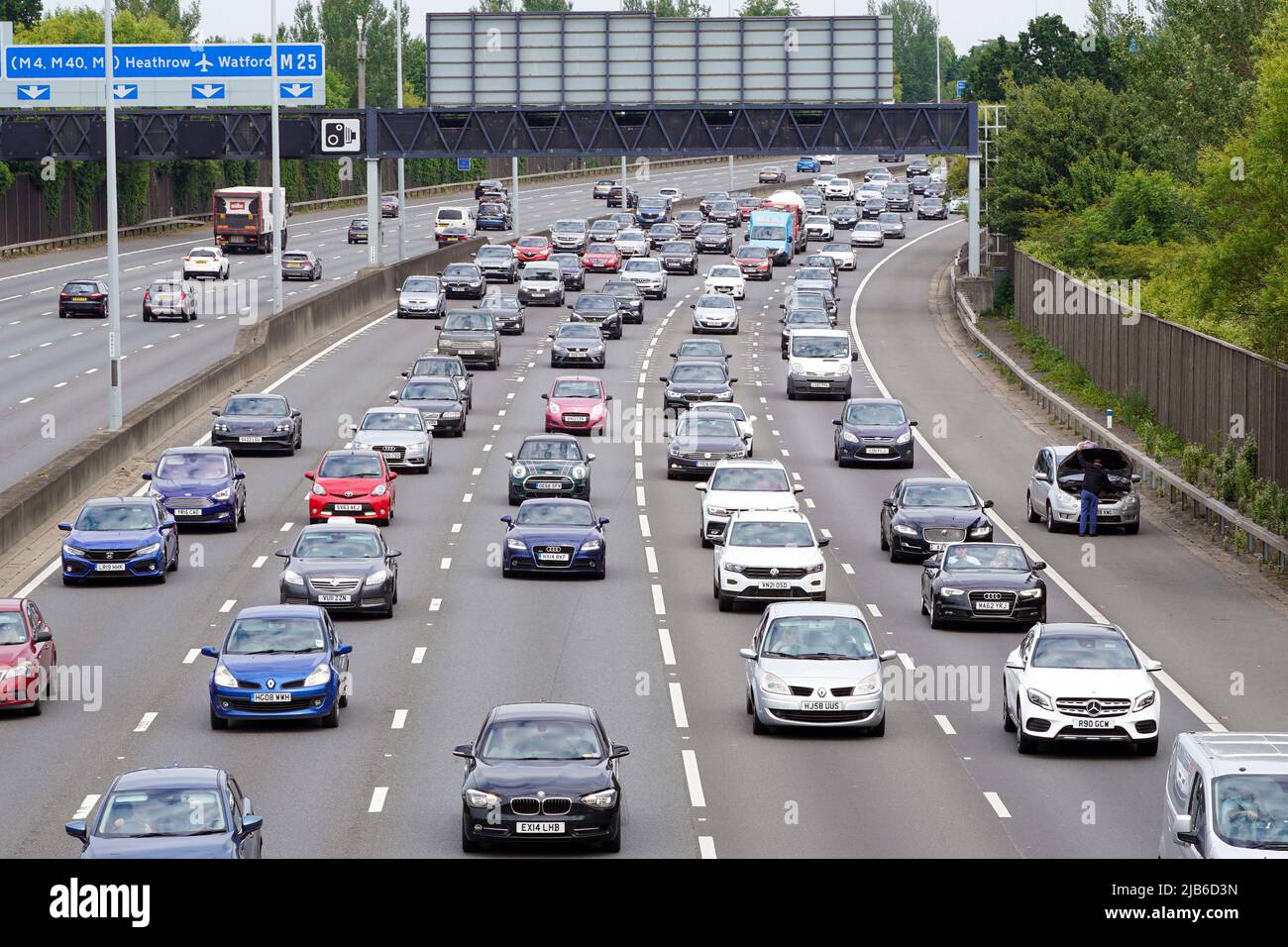 Vehicles queue on the M25 motorway near Egham, Surrey, on day two of ...