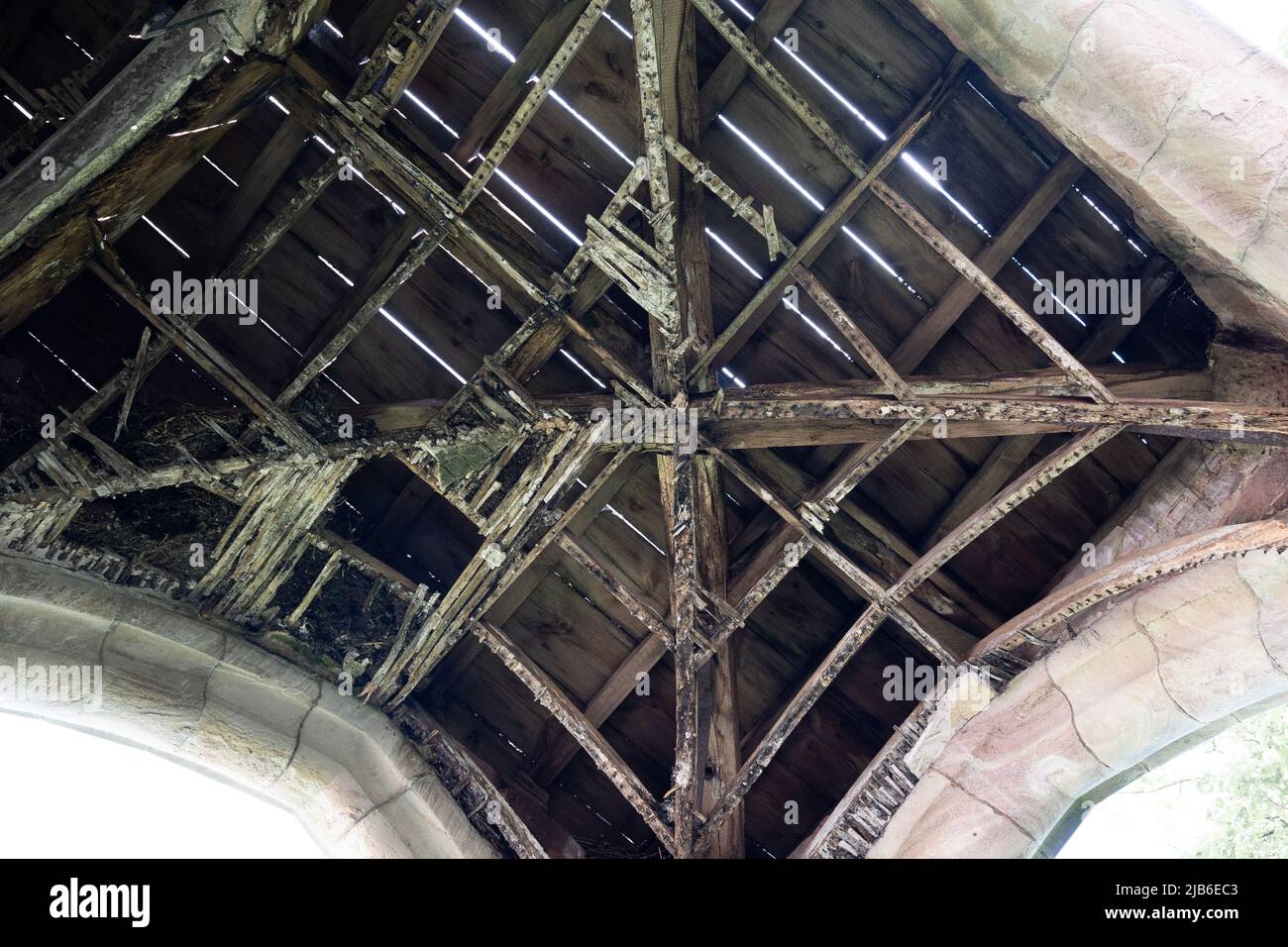 Historic timber roof structure with traditional wooden beams and stone ...