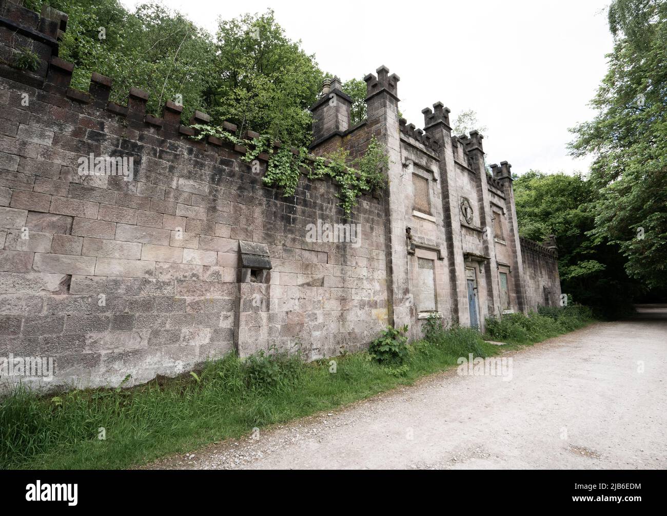 Historic stone castle gatehouse with decorative chimneys and ...