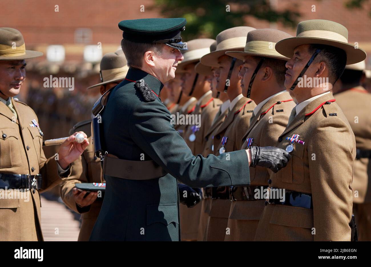 Members of The 1st Battalion, The Royal Gurkha Rifles receive their ...