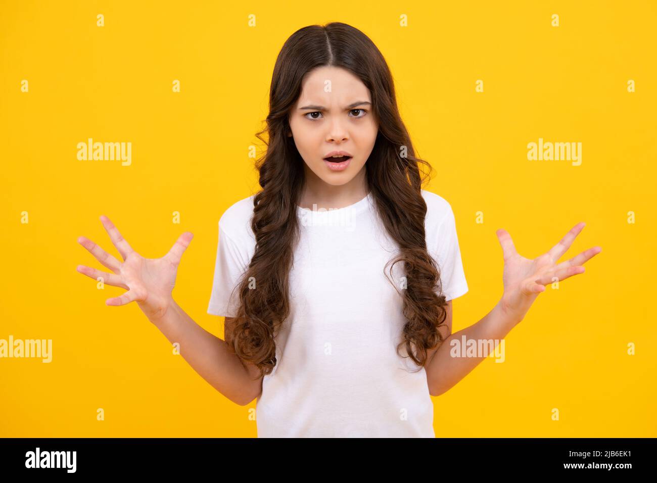 Angry teenager girl, upset and unhappy negative emotion. Studio ...