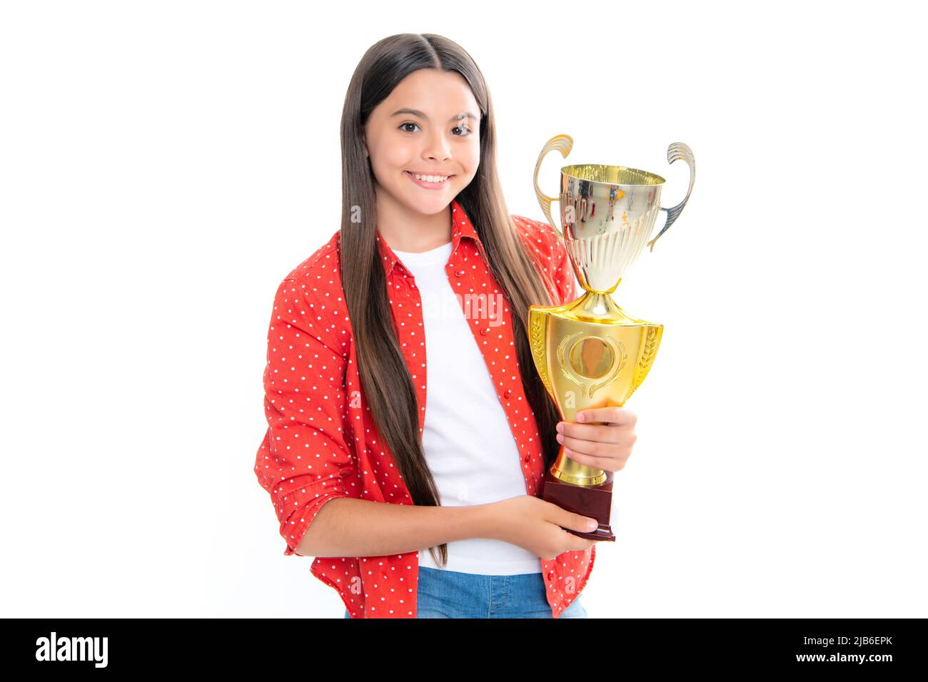Teenage girl holding a trophy. Kid winner won the competition ...