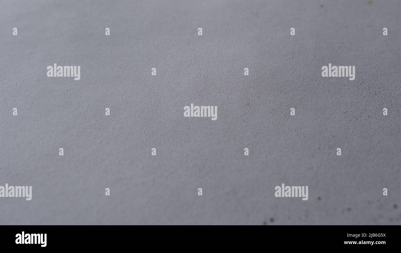 Steam or vapor clouds rising from boiling water with foam and watter ...