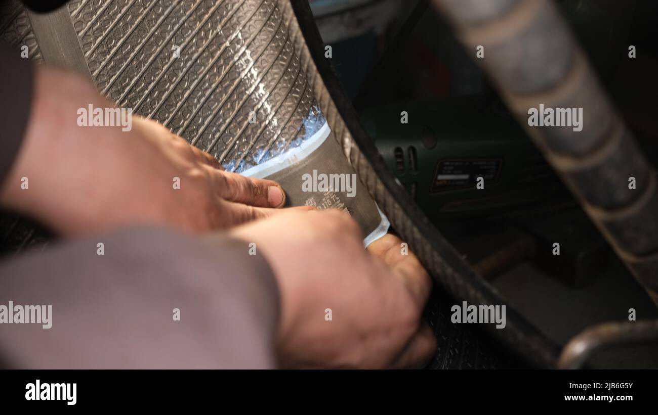 Repair service for wheel tire of car from big side puncture, cut with ...