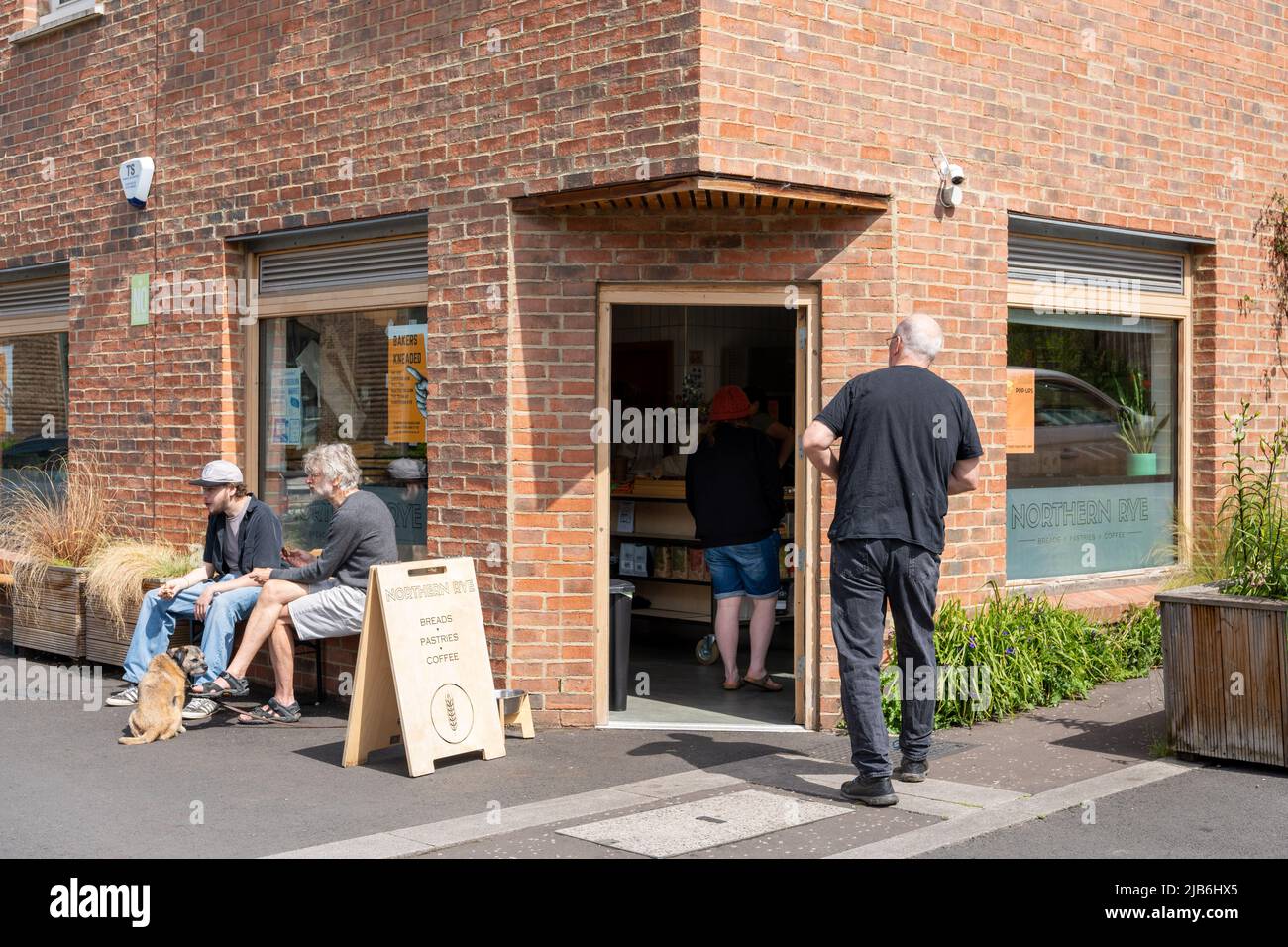 People queue and sit outside Northern Rye, a destination bakery in the ...