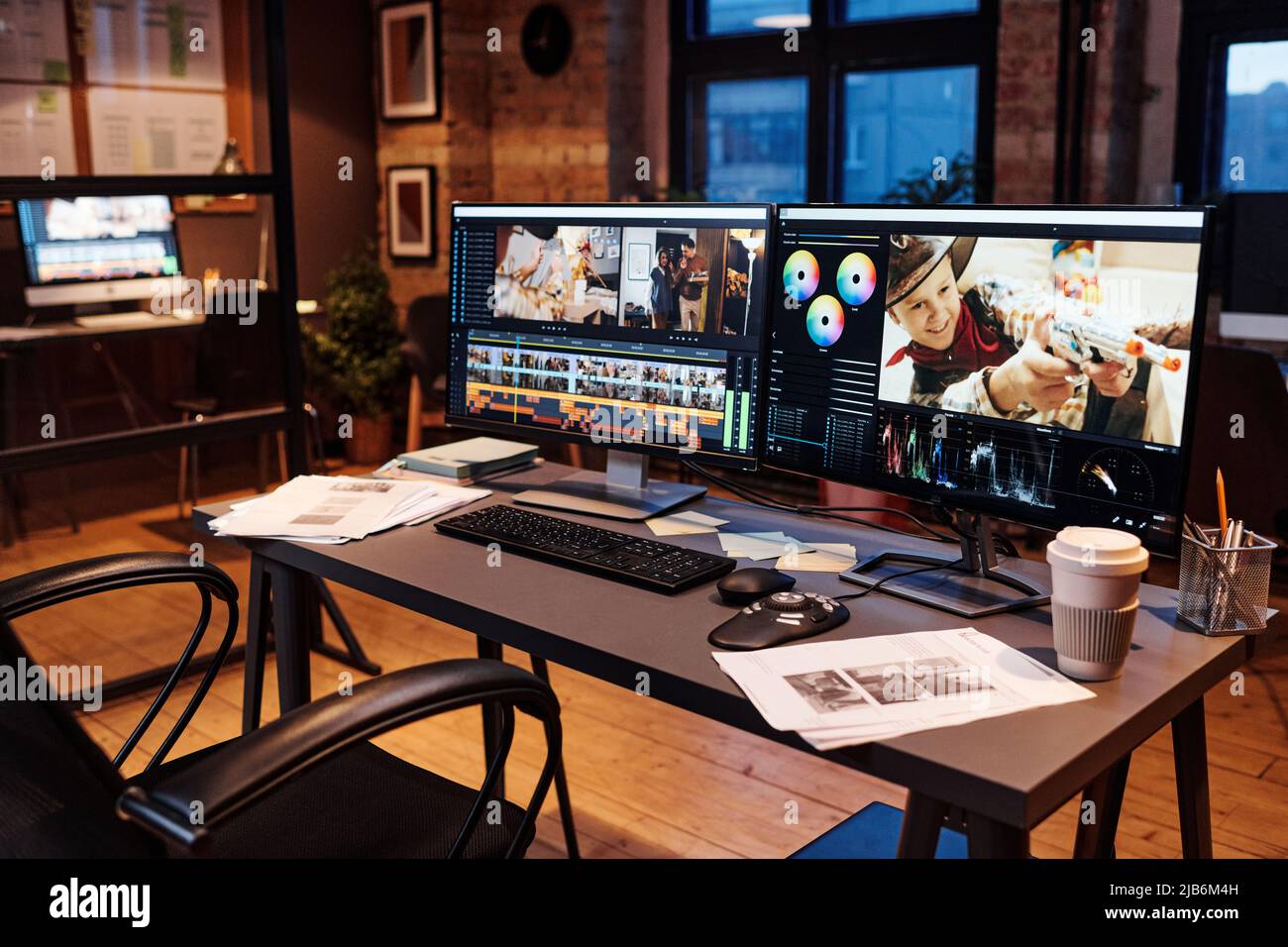 Desktop computer with photo editing software standing on the desk in ...