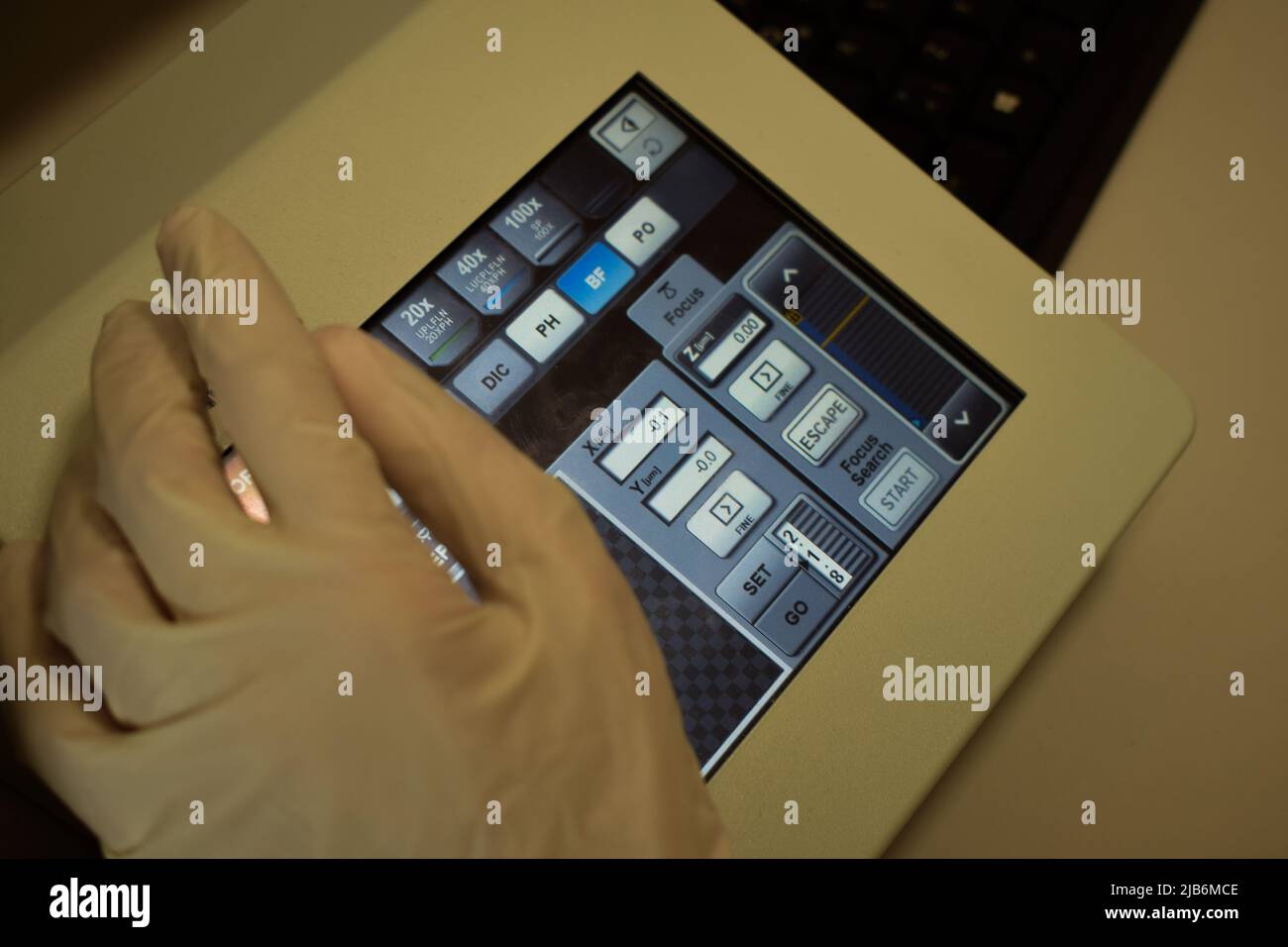 Researcher setting a scientific device for usage Stock Photo - Alamy