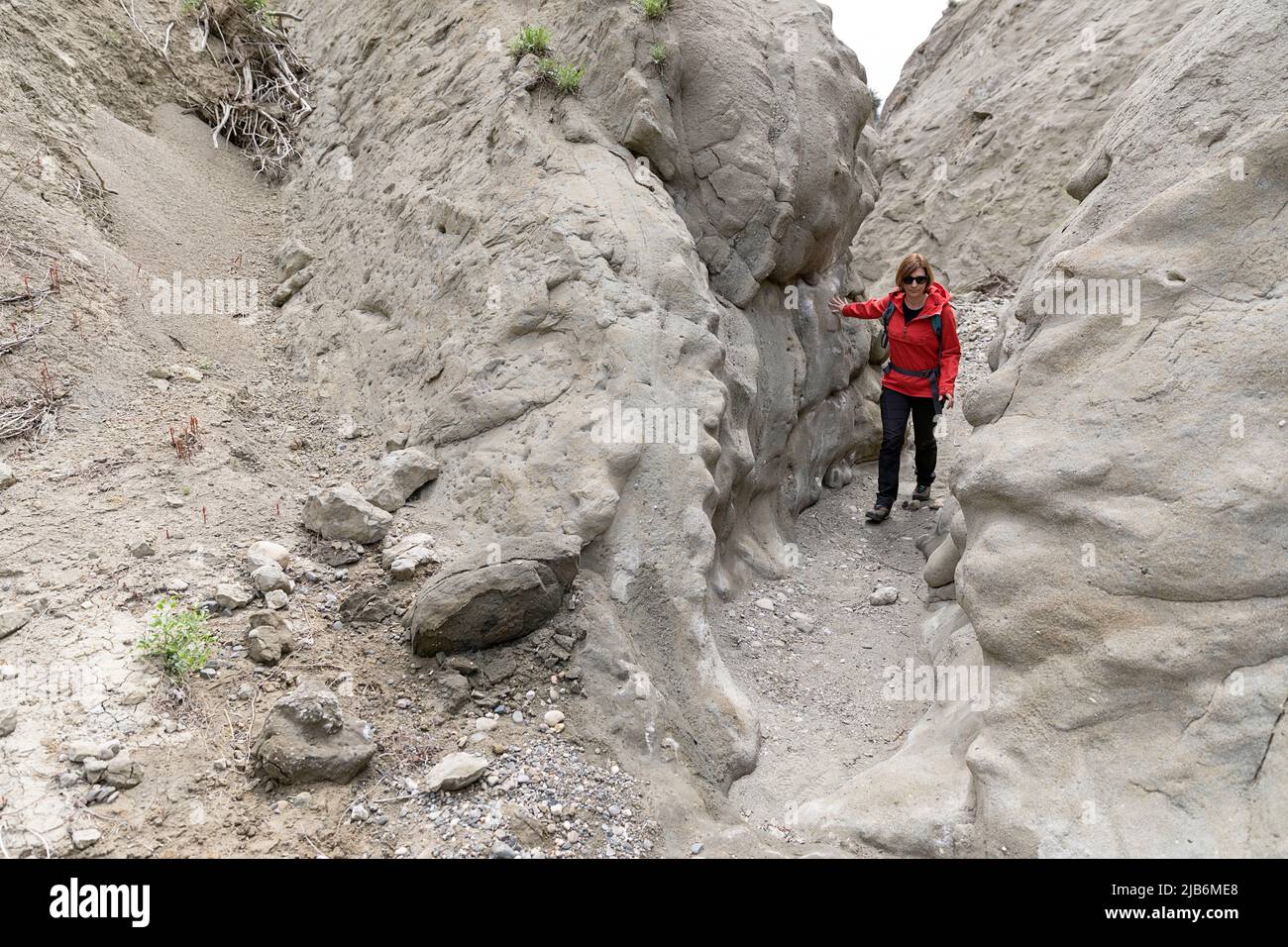 Woman walking the narrow trail in Bear gorge, Datvis Khevi, Georgia ...