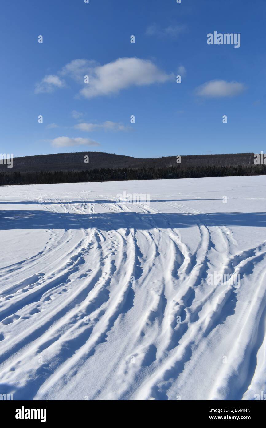 Snowmobile tracks on the lake, Québec, Canada Stock Photo - Alamy