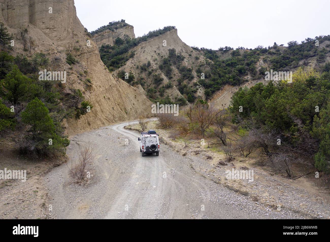 4x4 campervan driving trough dry riverbed, Vashlovani protected area ...