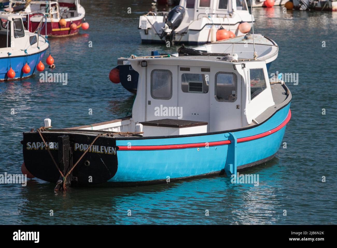 Fishing boats and other small craft in the Cornish fishing harbour of ...
